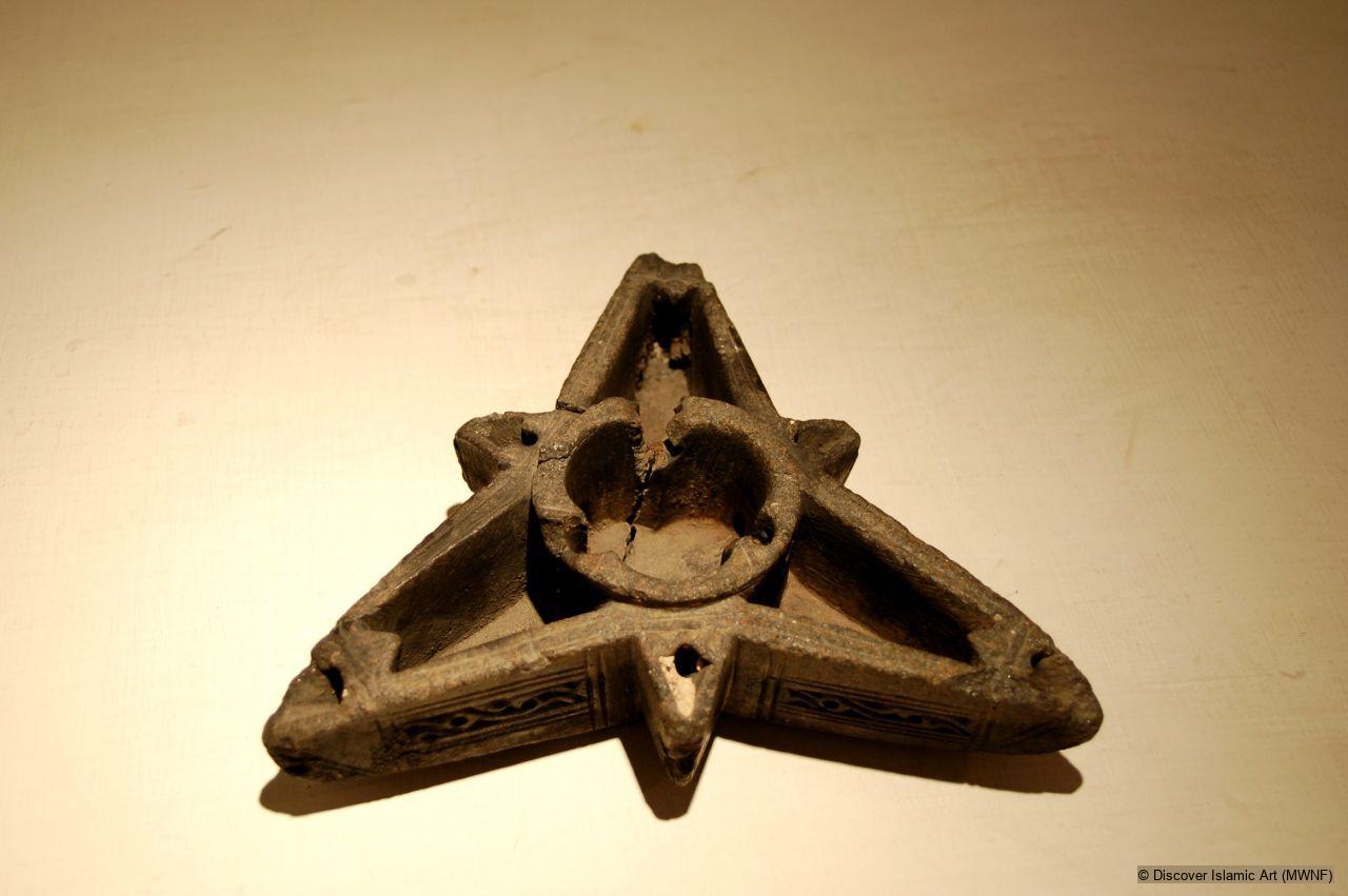 Two steatite (soapstone) oil lamps: a) star-shaped oil lamp; b) triplet ...